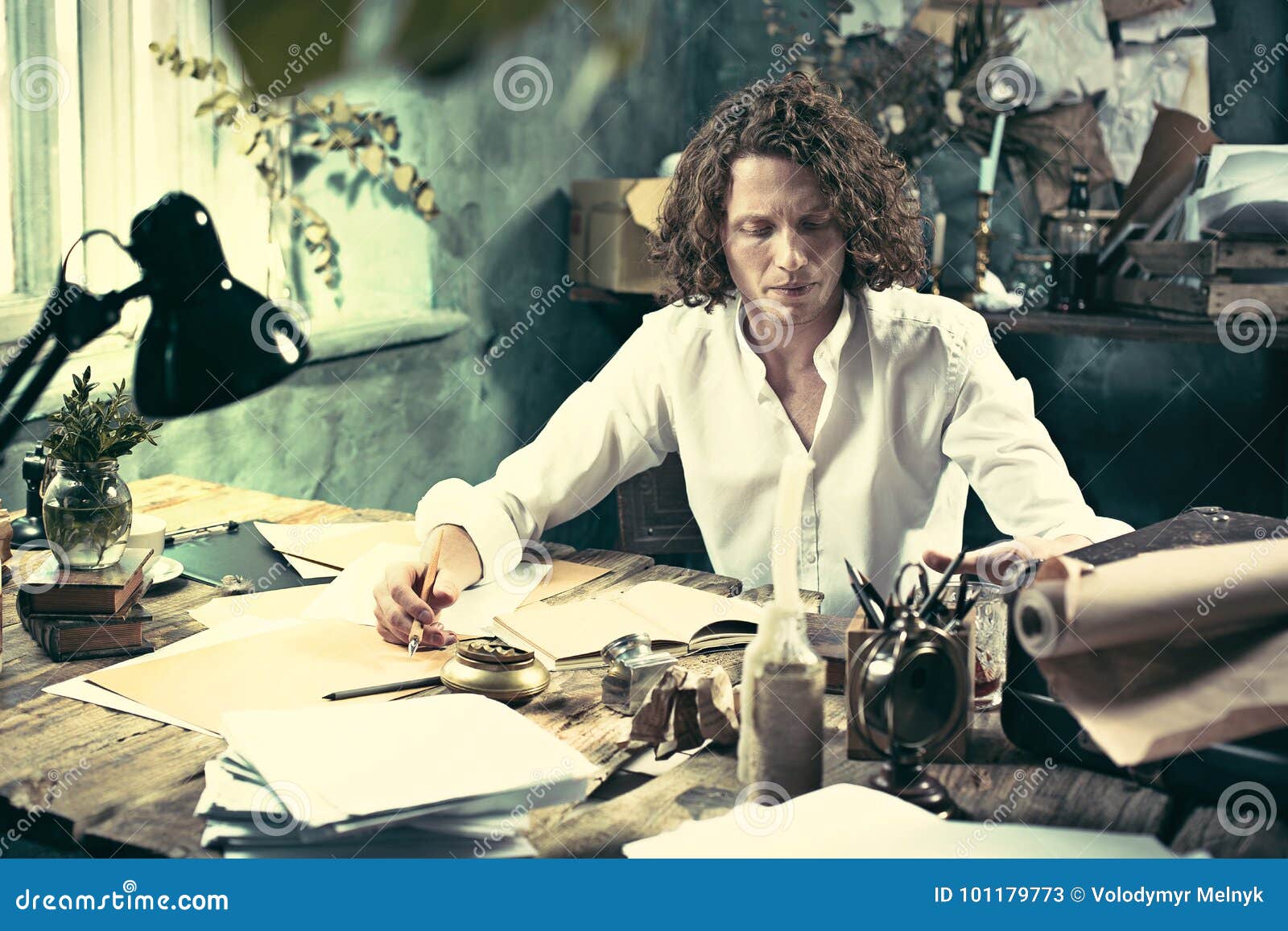 Writer at Work. Handsome Young Writer Sitting at the Table and Writing ...