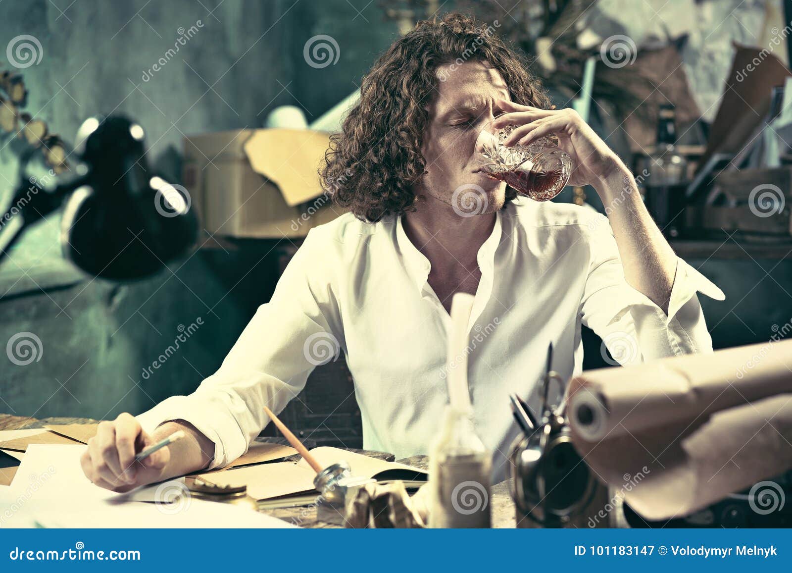 Writer at Work. Handsome Young Writer Sitting at the Table and Writing ...