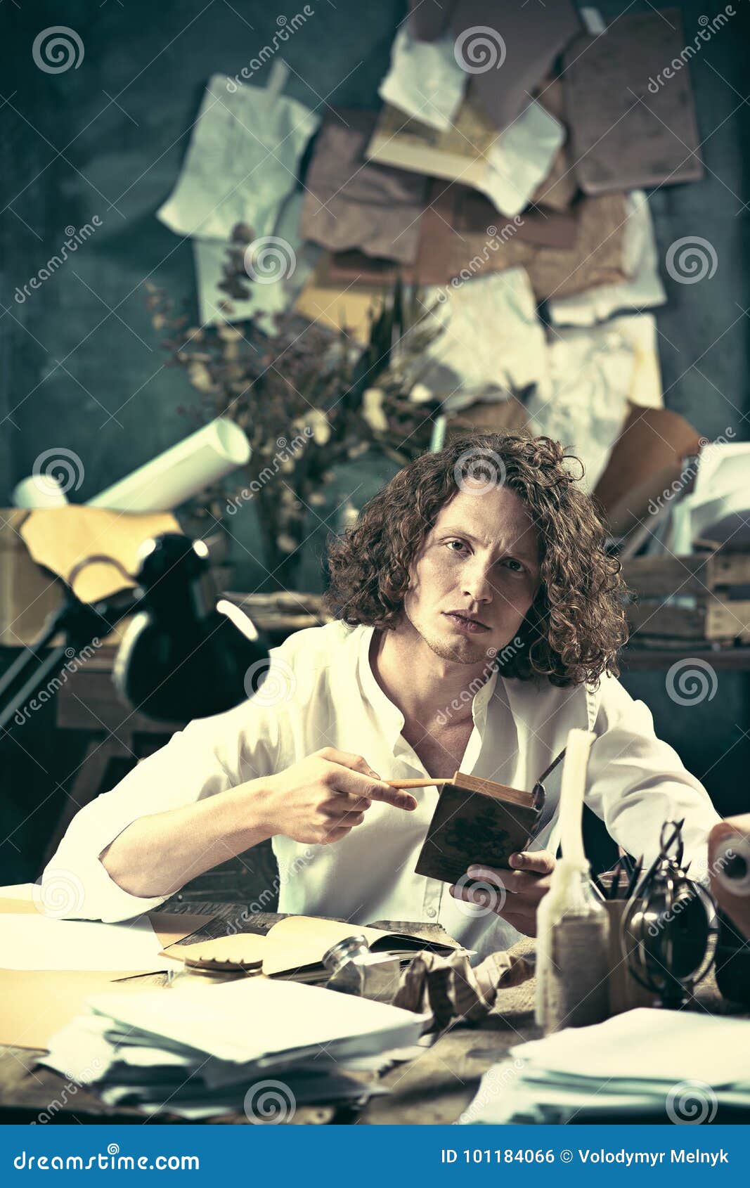 Writer at Work. Handsome Young Writer Sitting at the Table and Writing ...