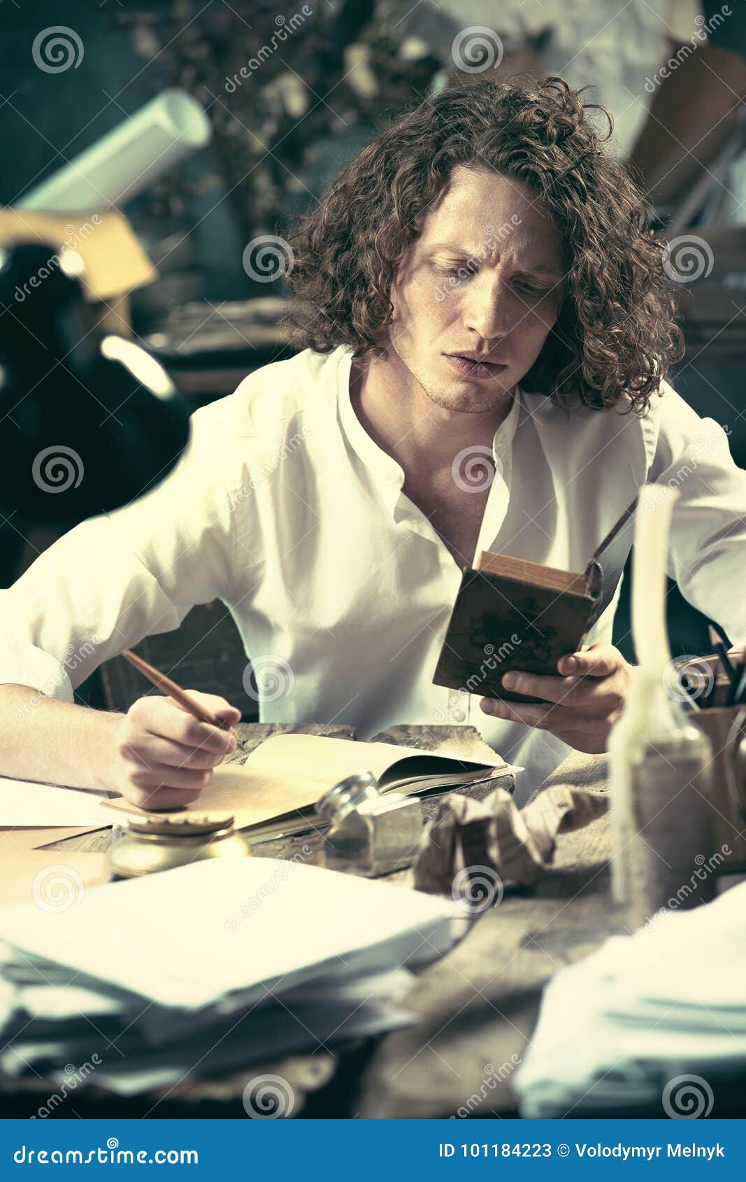 Writer at Work. Handsome Young Writer Sitting at the Table and Writing ...