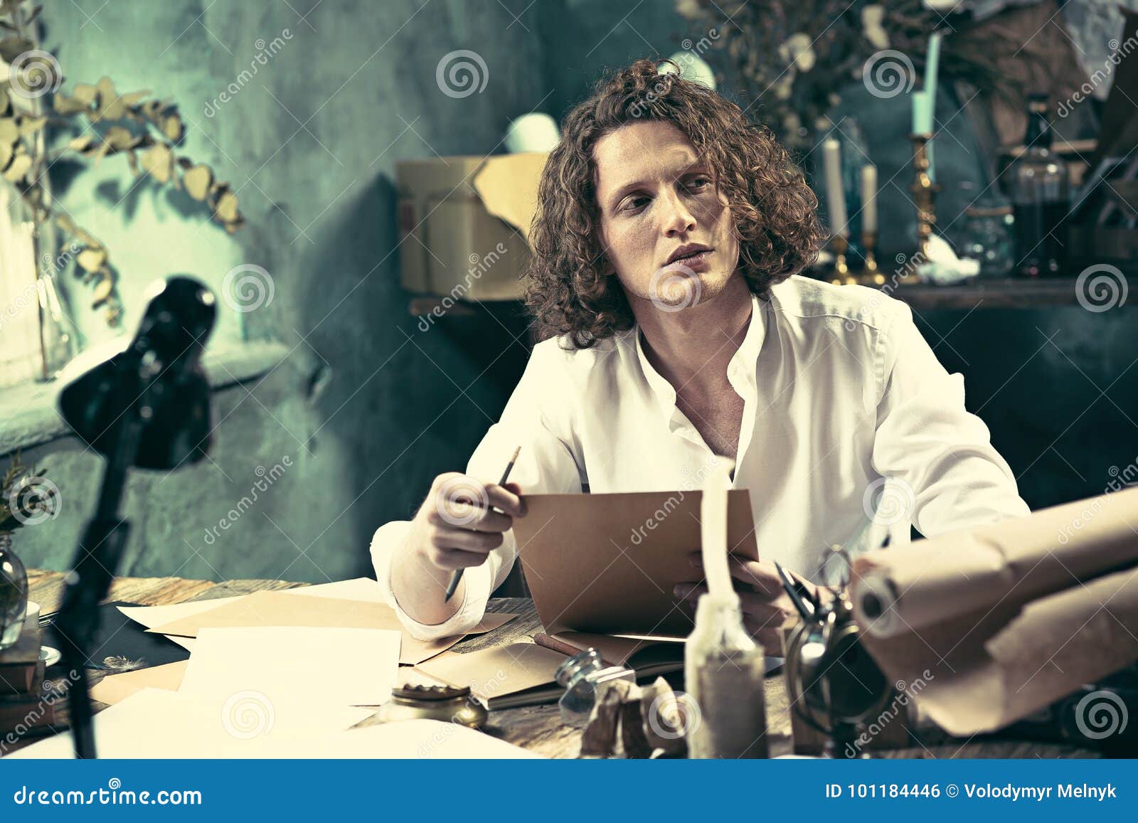 Writer at Work. Handsome Young Writer Sitting at the Table and Writing ...