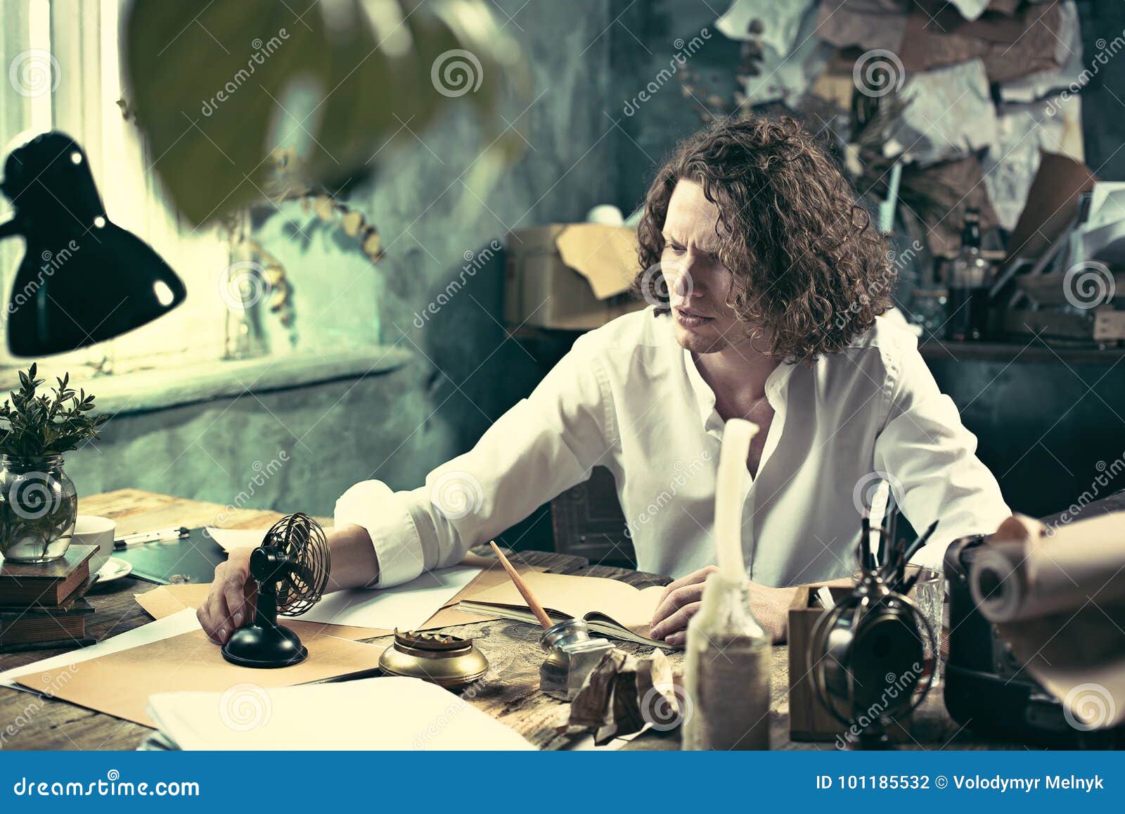 Writer at Work. Handsome Young Writer Sitting at the Table and Writing ...