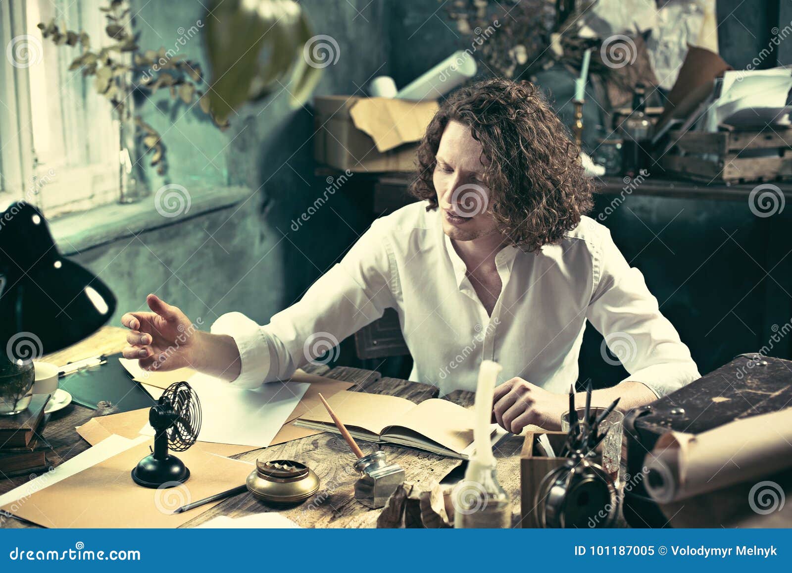 Writer at Work. Handsome Young Writer Sitting at the Table and Writing ...