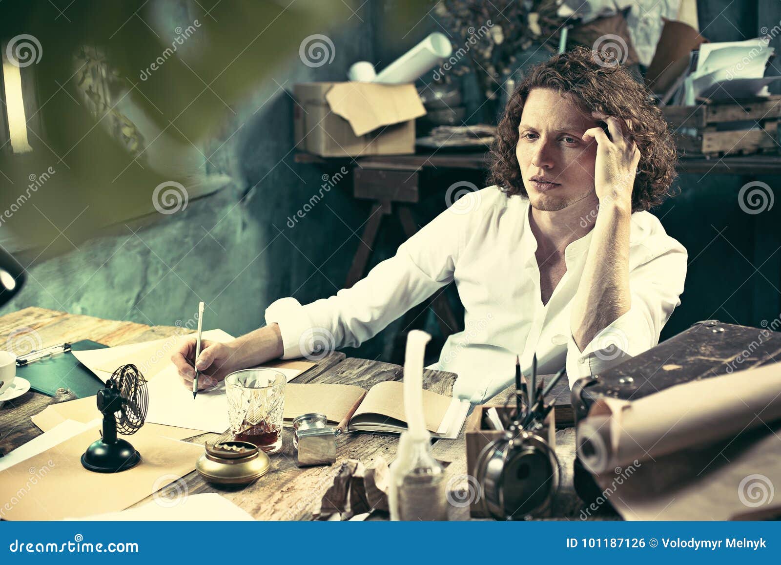 Writer at Work. Handsome Young Writer Sitting at the Table and Writing ...
