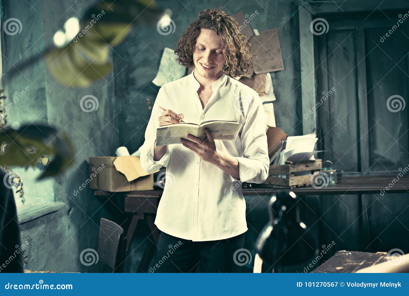 Writer at Work. Handsome Young Writer Standing Near the Table and ...