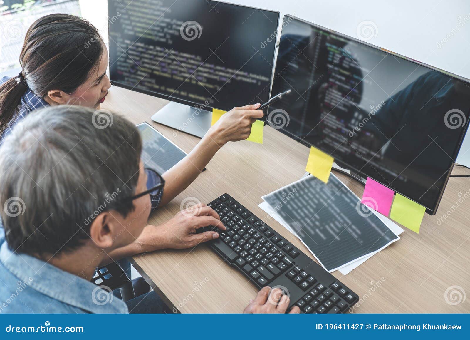 Writing Codes and Typing Data Code Technology, Two Professional Programmer Cooperating Working ...
