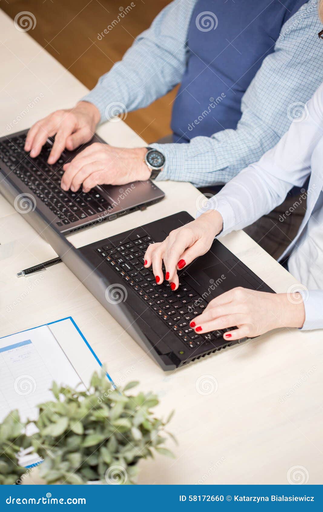 Writing on computers stock photo. Image of businesspeople - 58172660