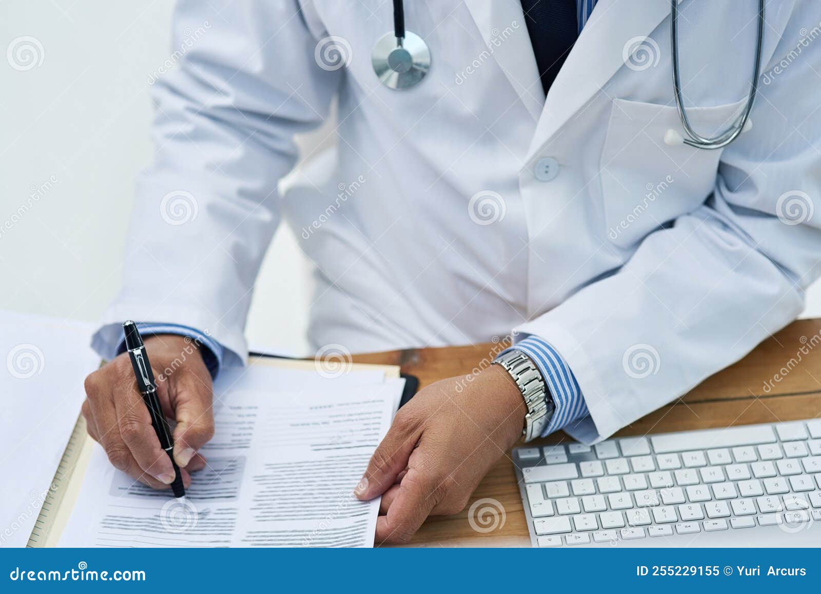 Writing a Doctors Note. Closeup Shot of a Doctor Using a Computer and ...
