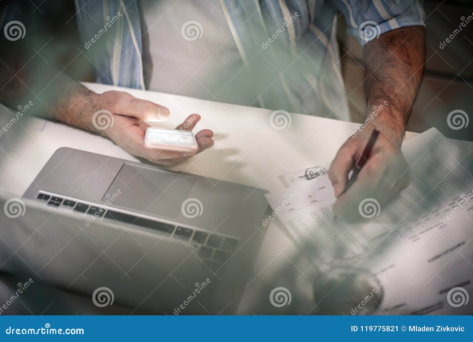 Writing on Document and Using Smart Phone. Close Up. Stock Image ...