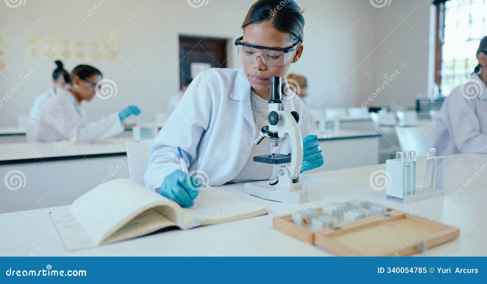 Writing, Girl and Microscope in Science Classroom for Chemistry ...