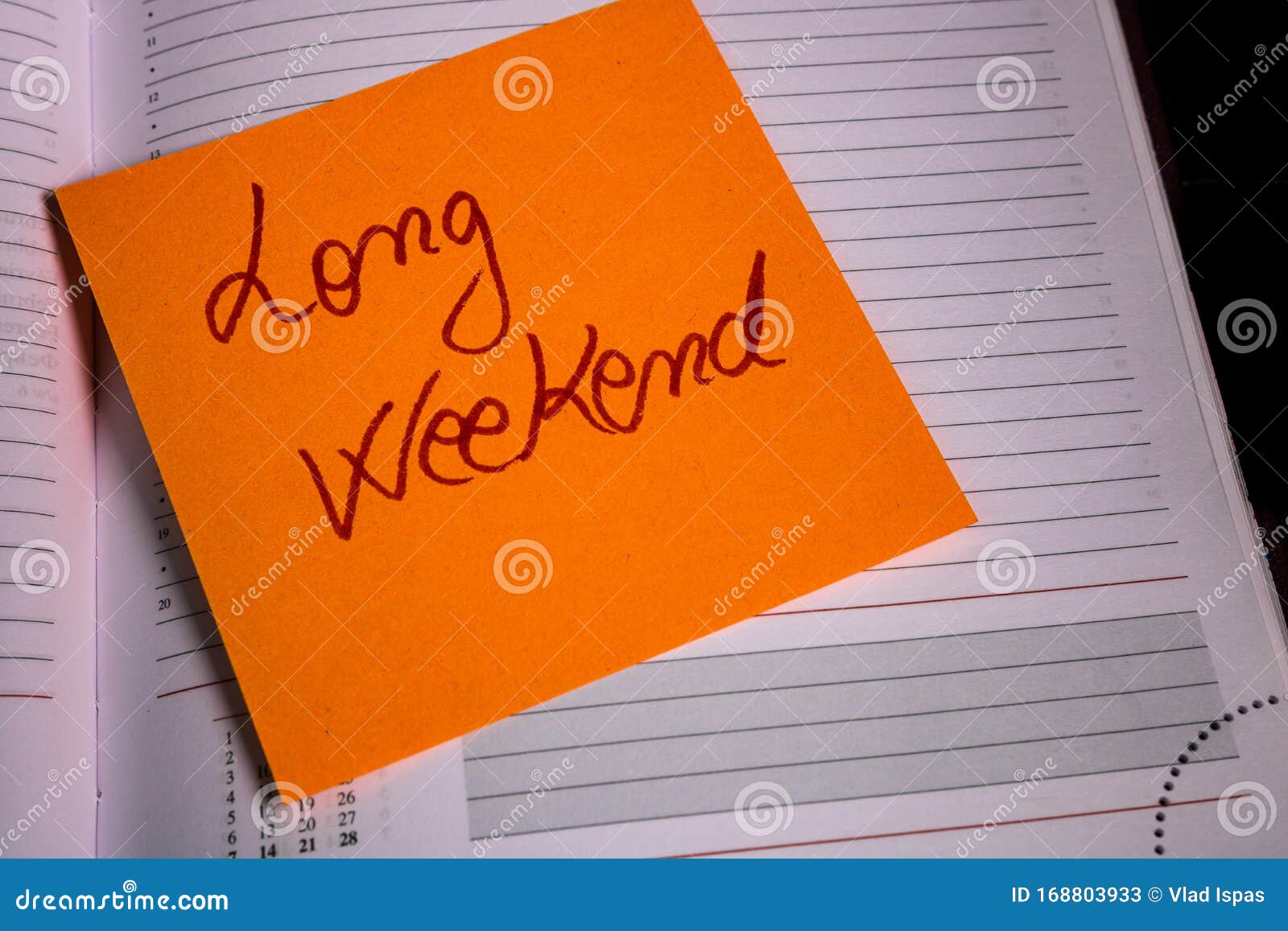 Writing Long Weekend on Memo Post Reminder. Text Long Weekend on Sticky ...