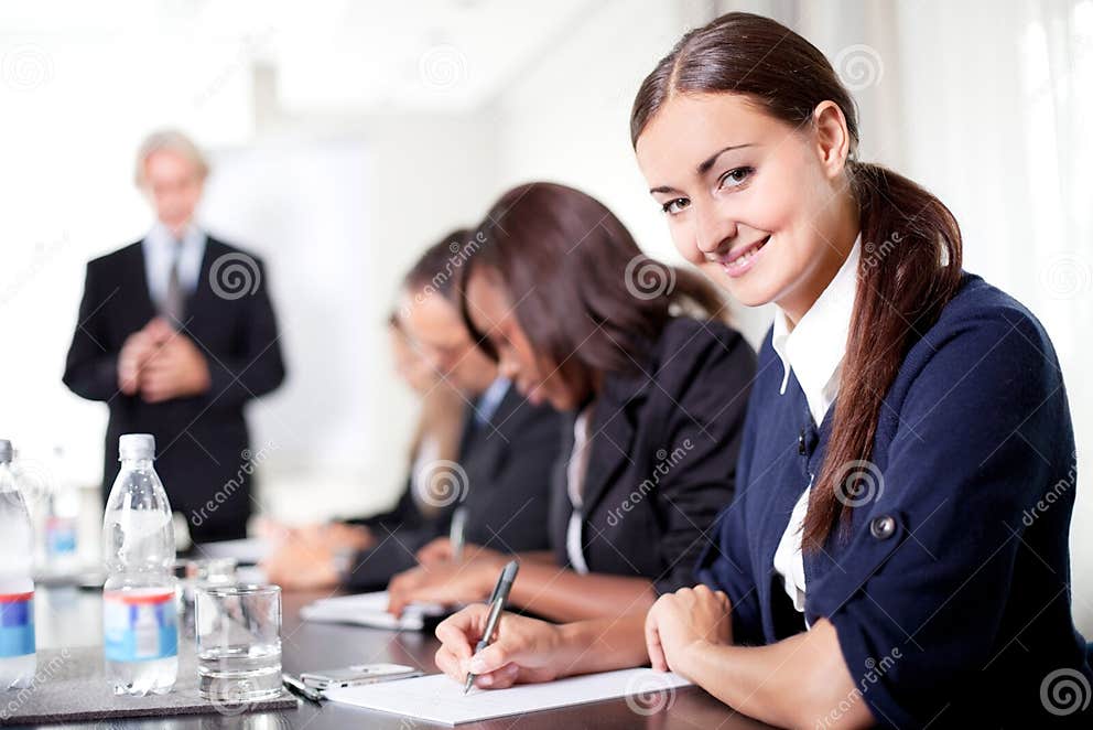 Writing Notes during a Business Training Stock Photo - Image of young ...
