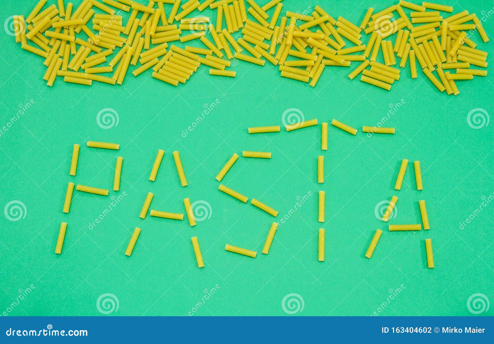 Writing Pasta on a Green Background with the Macaroni Type Pasta with ...