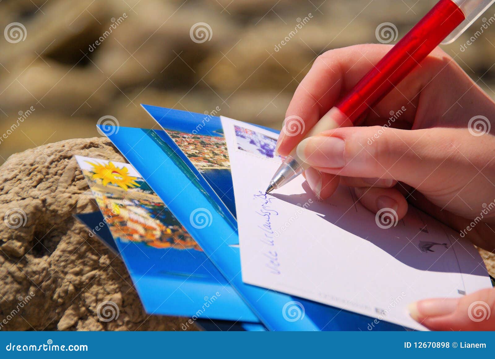 Writing a picture postcard stock photo. Image of female - 12670898