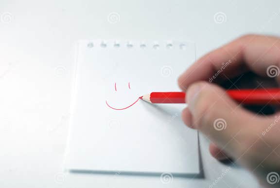 Writing a Smiley on a Note Paper Stock Photo - Image of gift, hold: 5964236