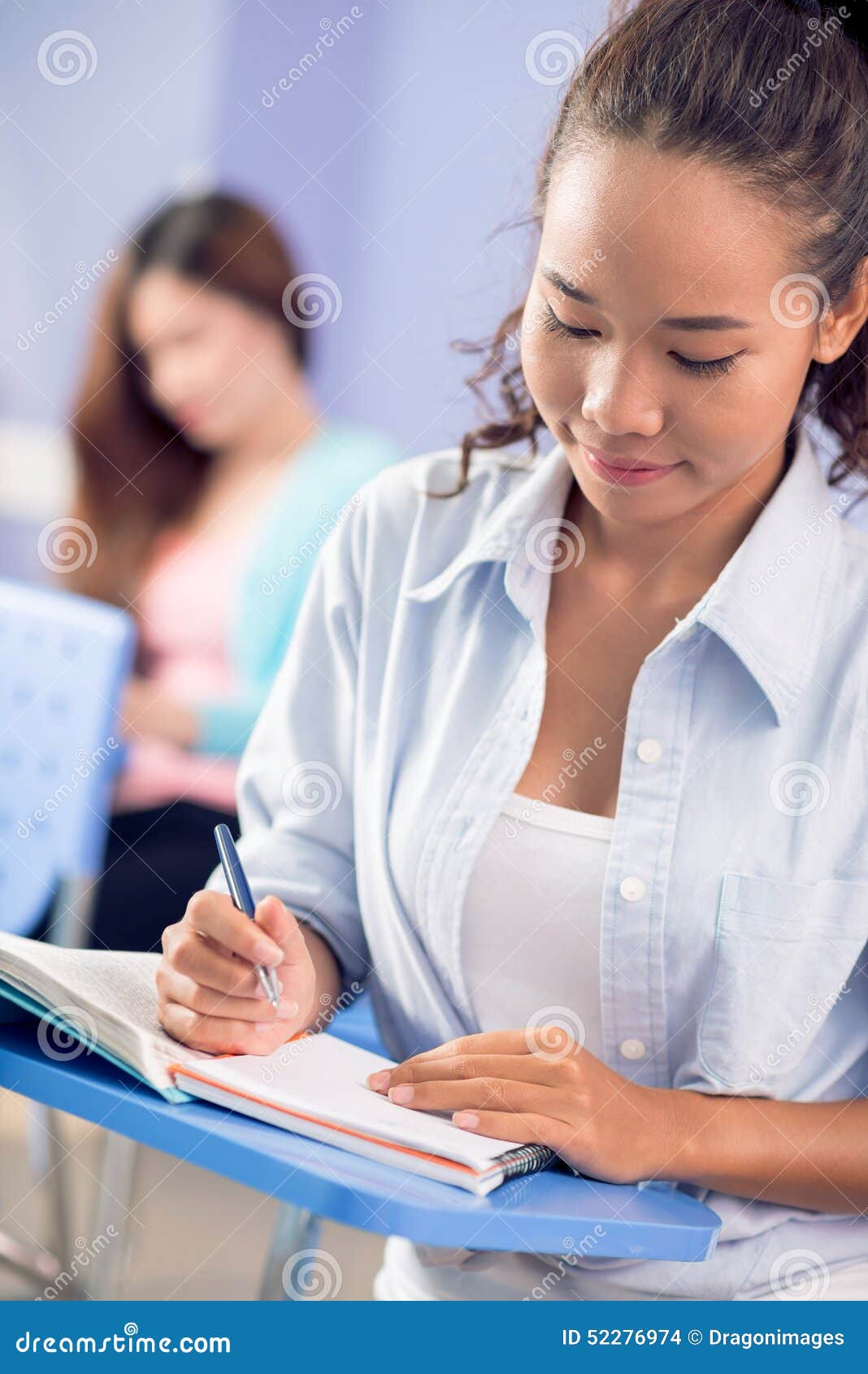 Writing in textbook stock photo. Image of lesson, sitting - 52276974