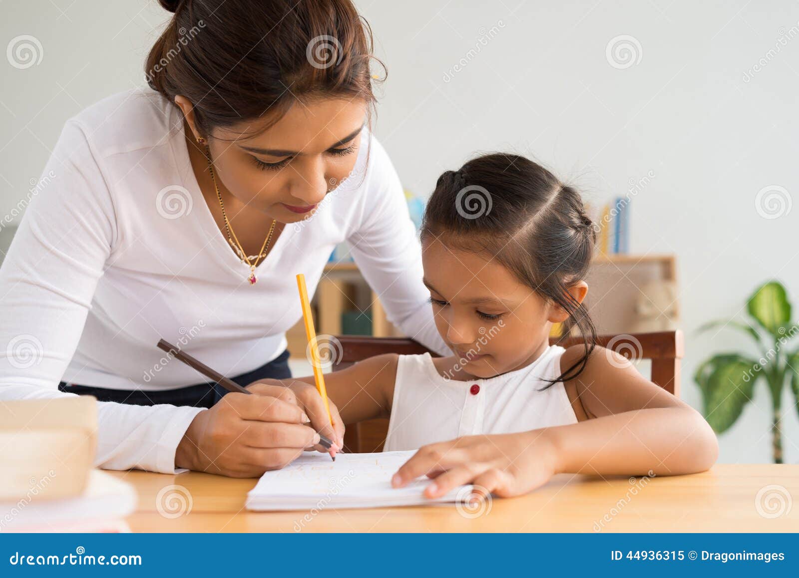 Writing together stock image. Image of child, homework - 44936315