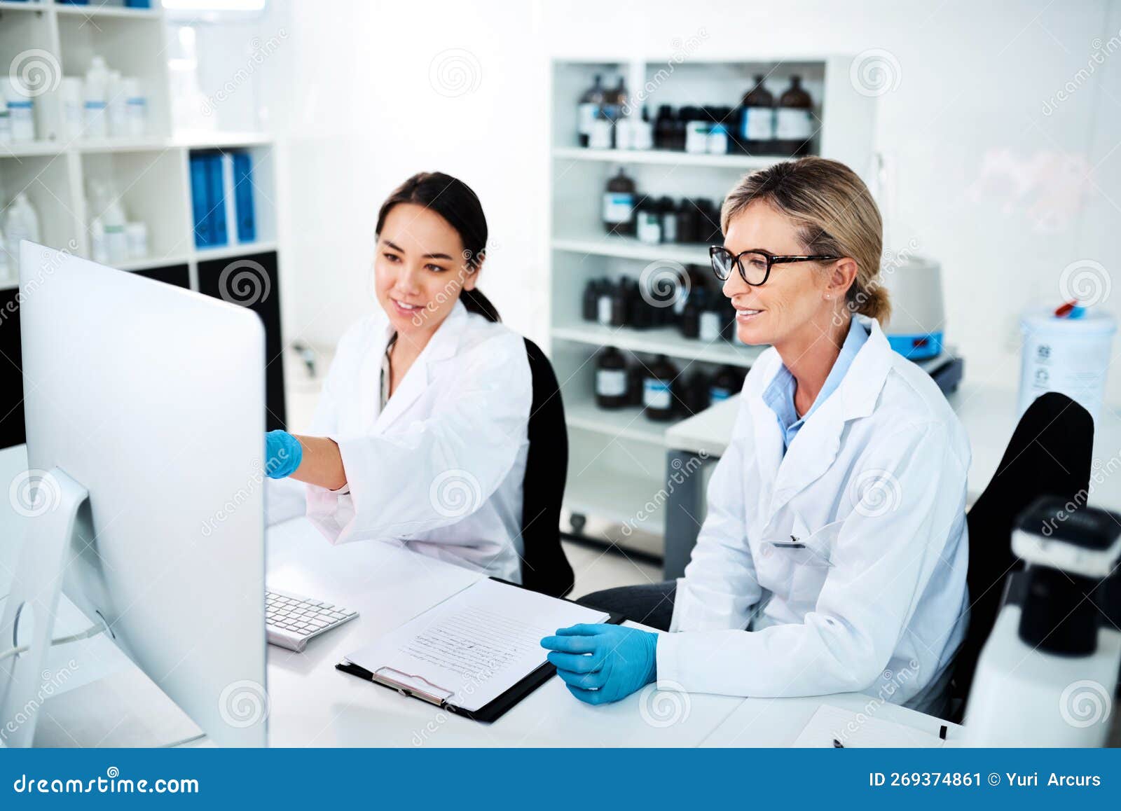 Writing Up a Few Clinical Reports Together. Two Scientists Working ...