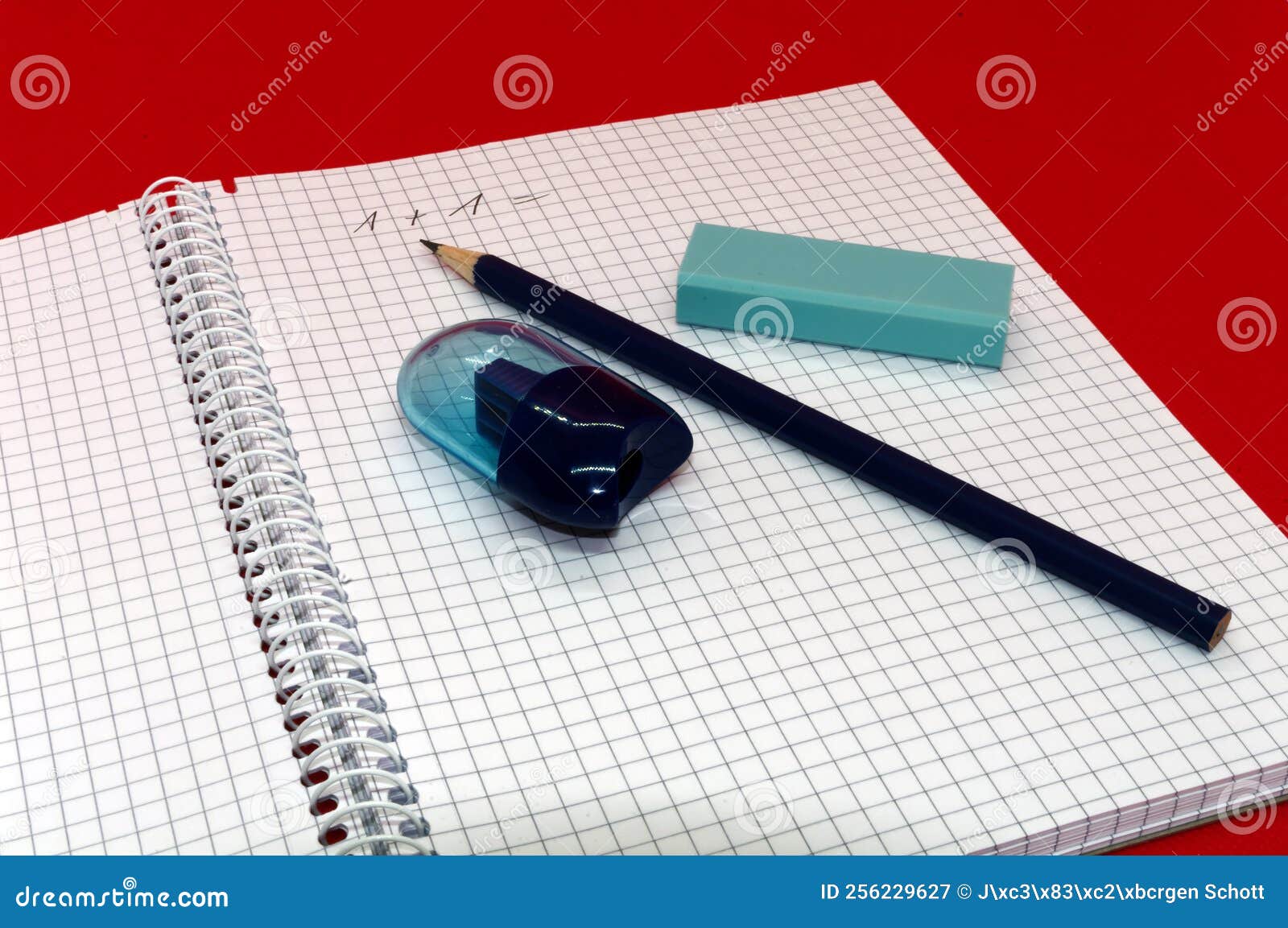 Pencil, Sharpener and Eraser on a Checkered Pad. Stock Image - Image of ...