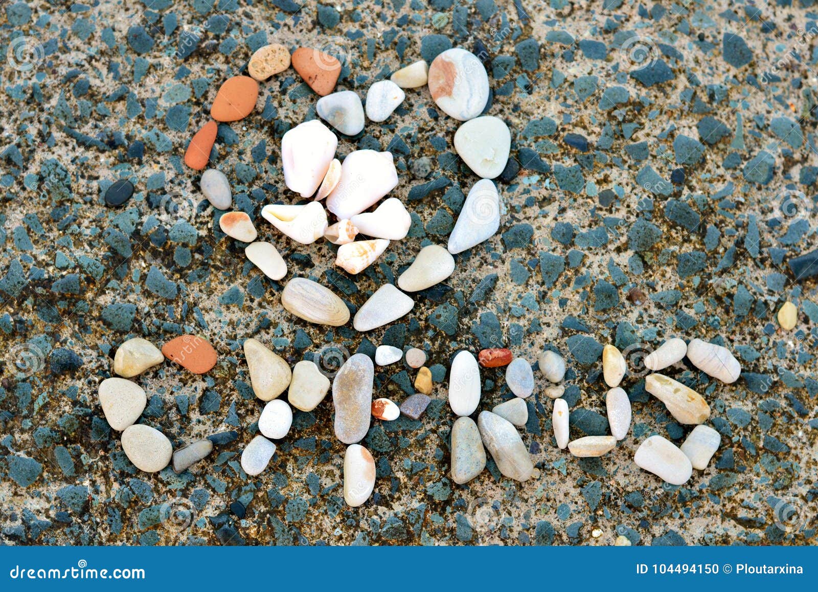 Written Pattern of Sea Shells and Stones on Rock Stock Photo - Image of ...