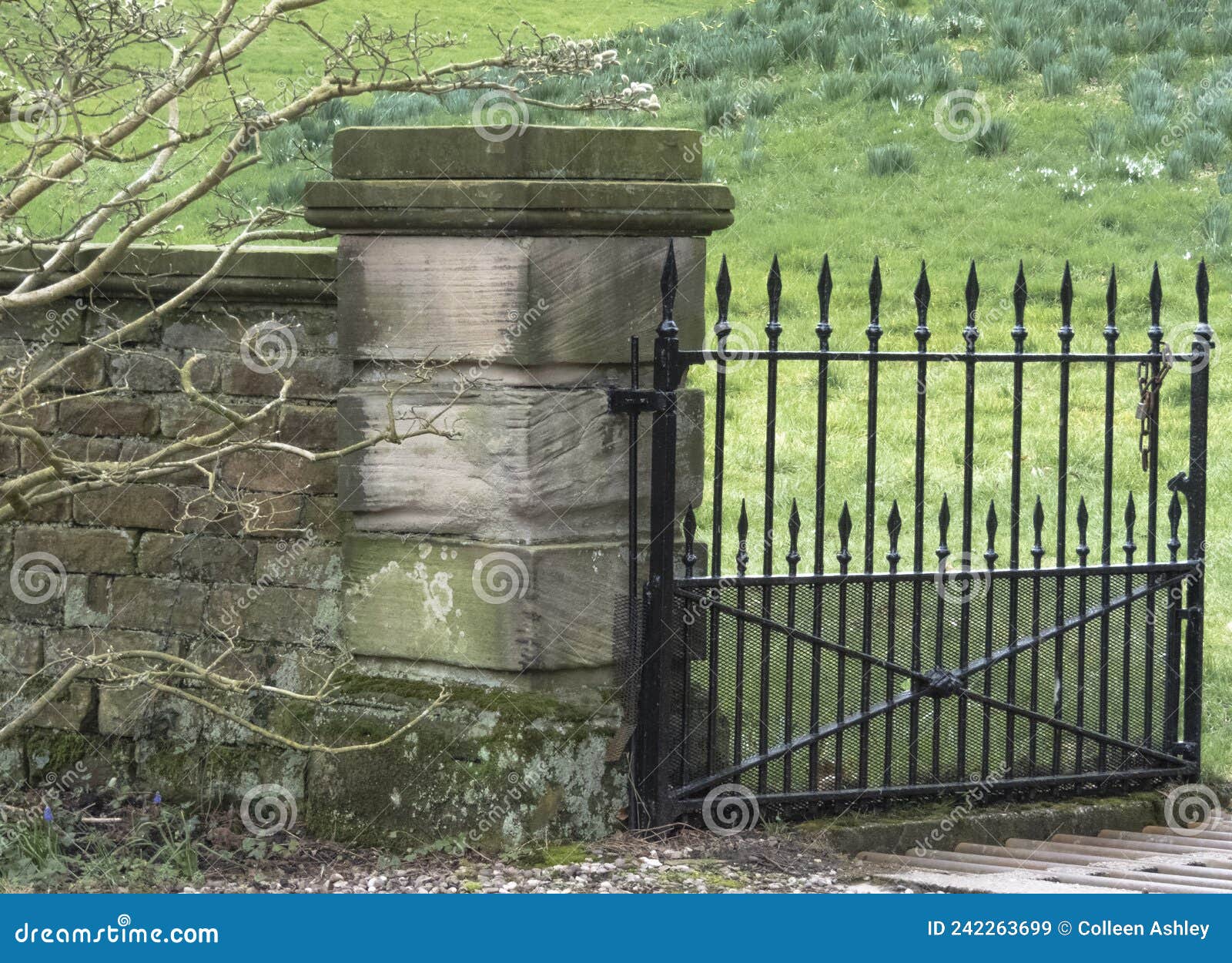 Wrought Iron Black Gateway with Stone Wall Stock Image - Image of ...