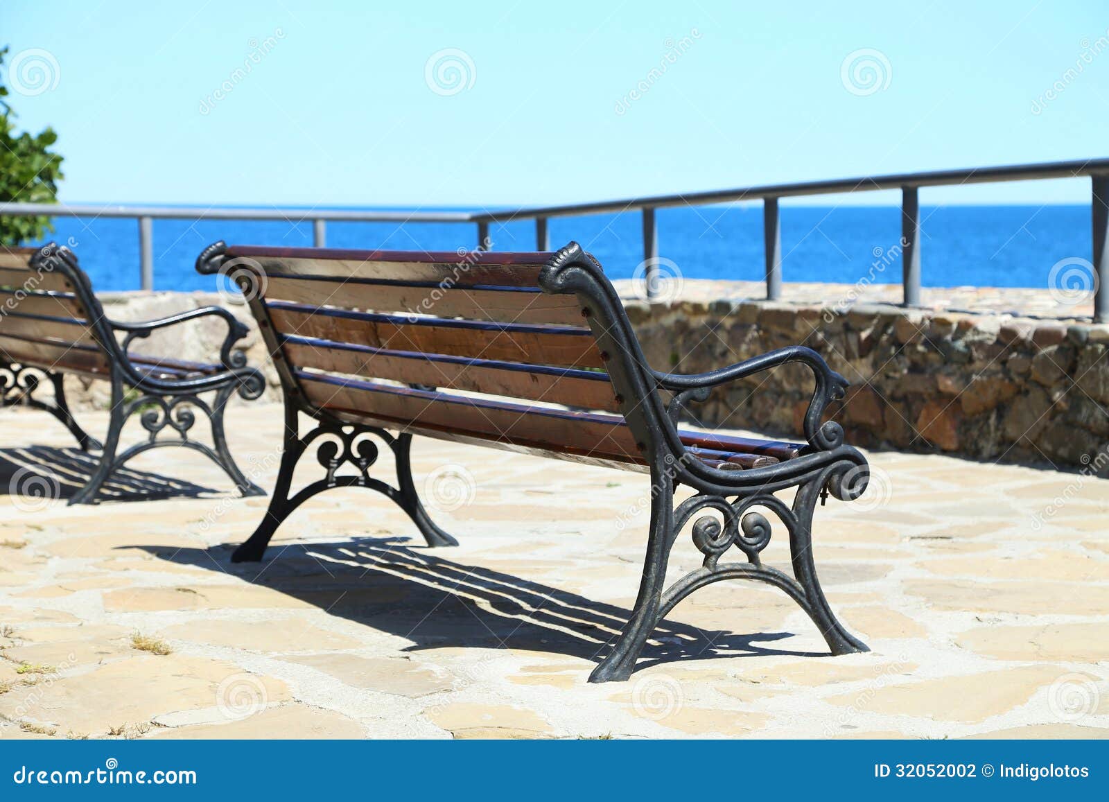 Wrought-iron Bench on a Stone Seafront. Stock Photo - Image of design ...
