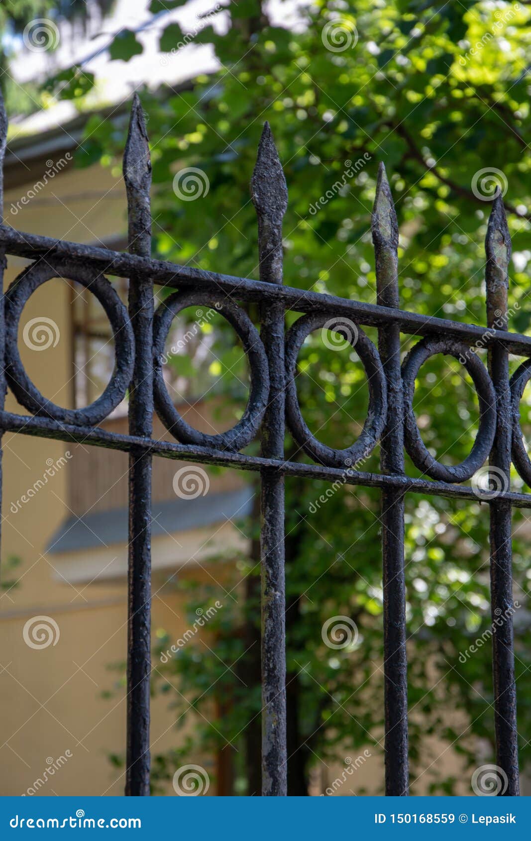 Wrought-iron Black Fence-grille in Front of the Old House Stock Image ...