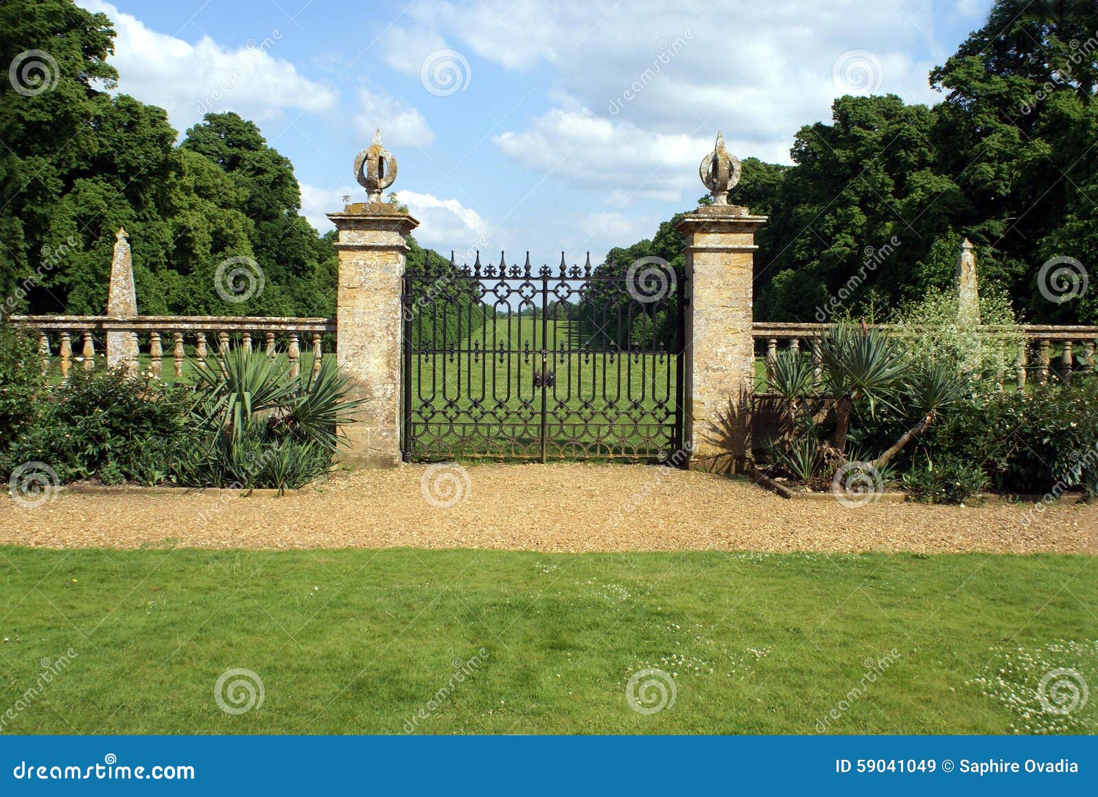 Wrought Iron Gate and Gate Posts with Sculptures Stock Image - Image of ...