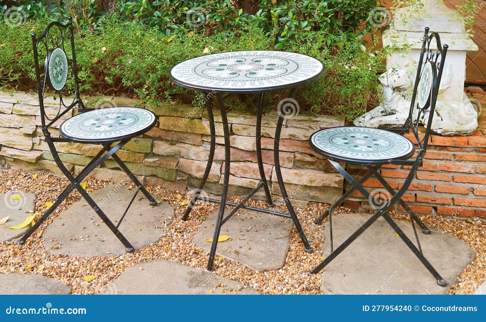 Wrought Iron Tea Table and Chairs in Garden Stock Photo - Image of iron ...