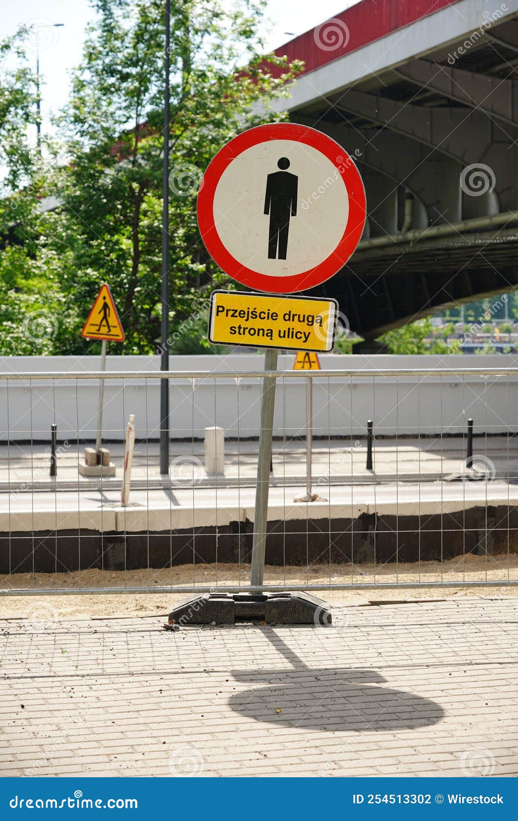 "Crossing on the Other Side of the Street" Sign, Vertical Stock Photo ...