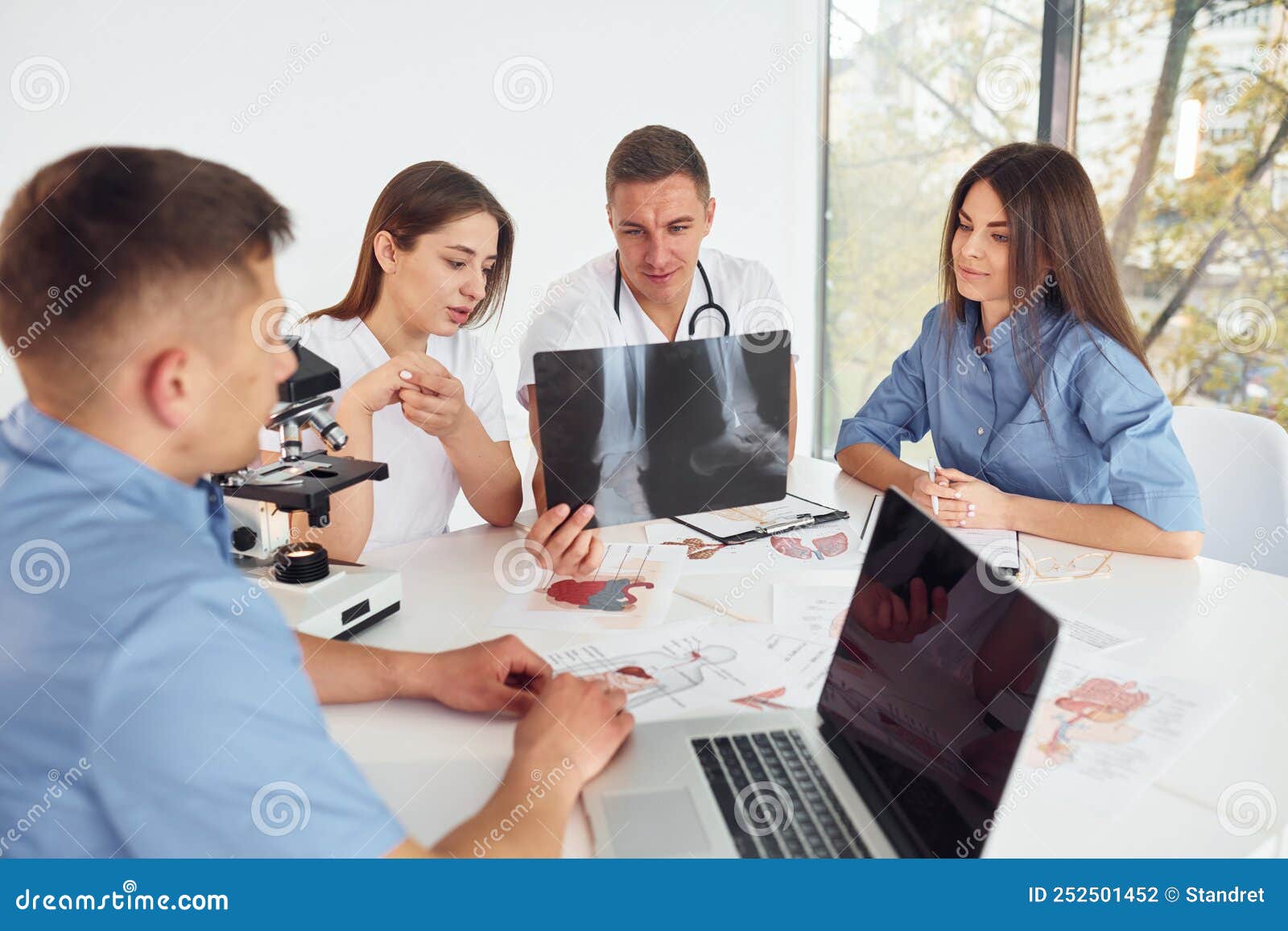 X-ray of Legs. Group of Young Doctors is Working Together in the Modern ...