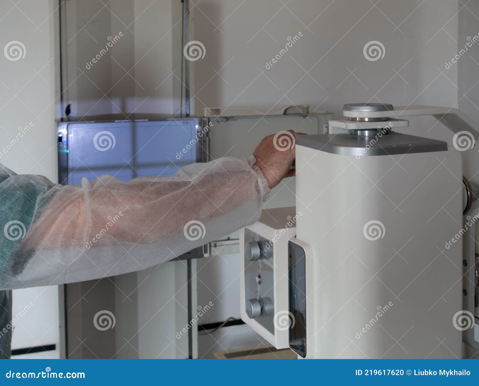An X-ray Technician Prepares the X-ray Machine for Work. Stock Photo ...
