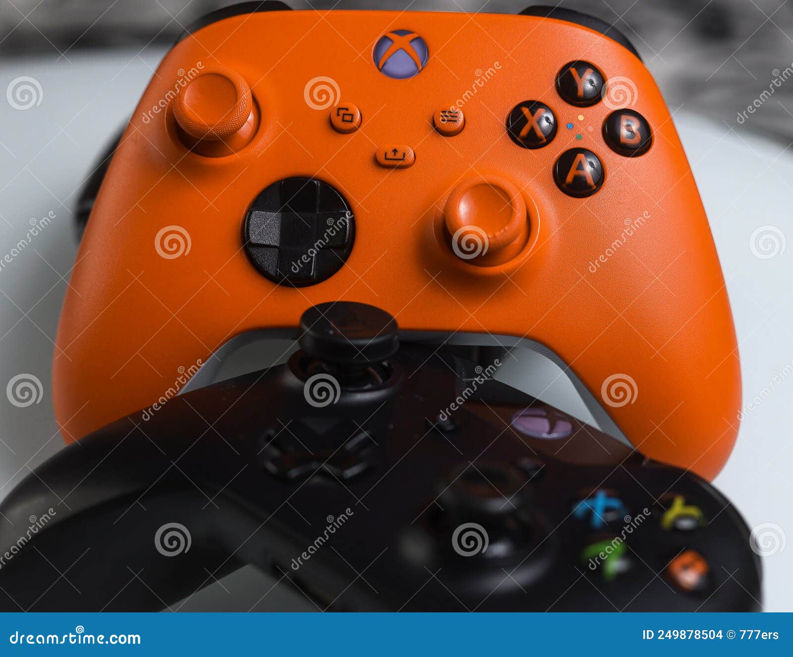 Xbox Game Controllers. Orange Game Controller Editorial Stock Image ...