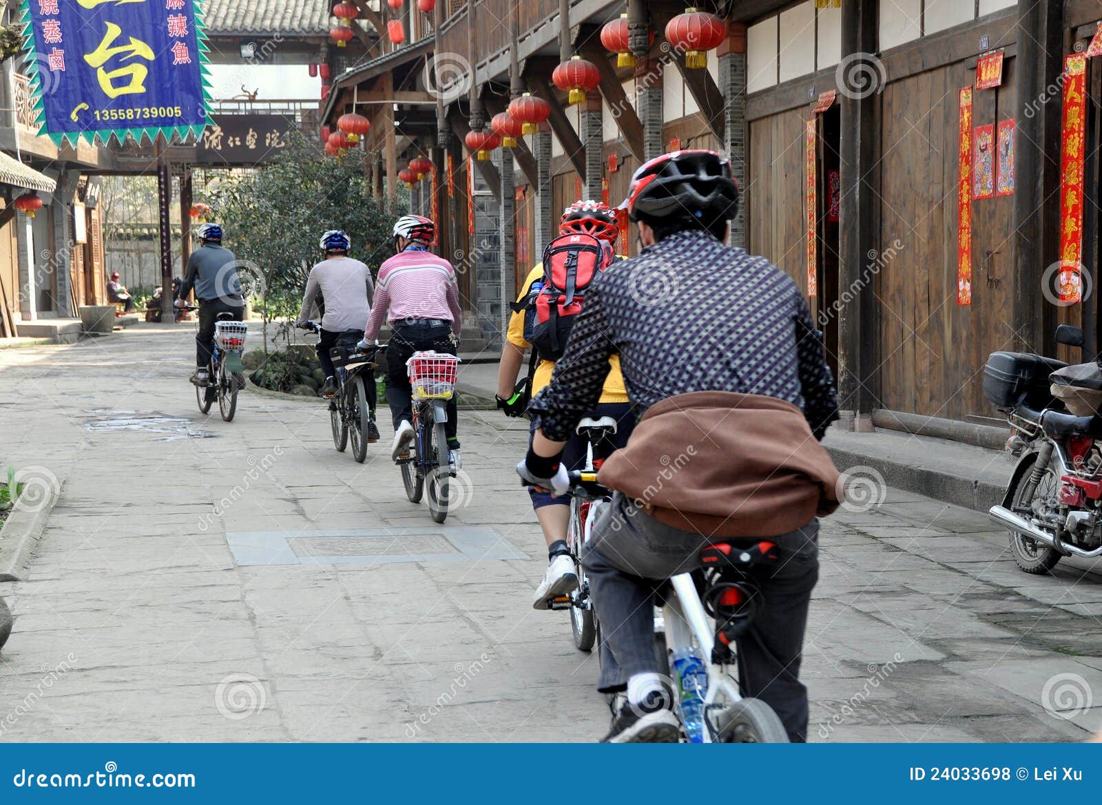 Xin Xing Zhen, China: Bikers Riding in Town Editorial Stock Photo ...