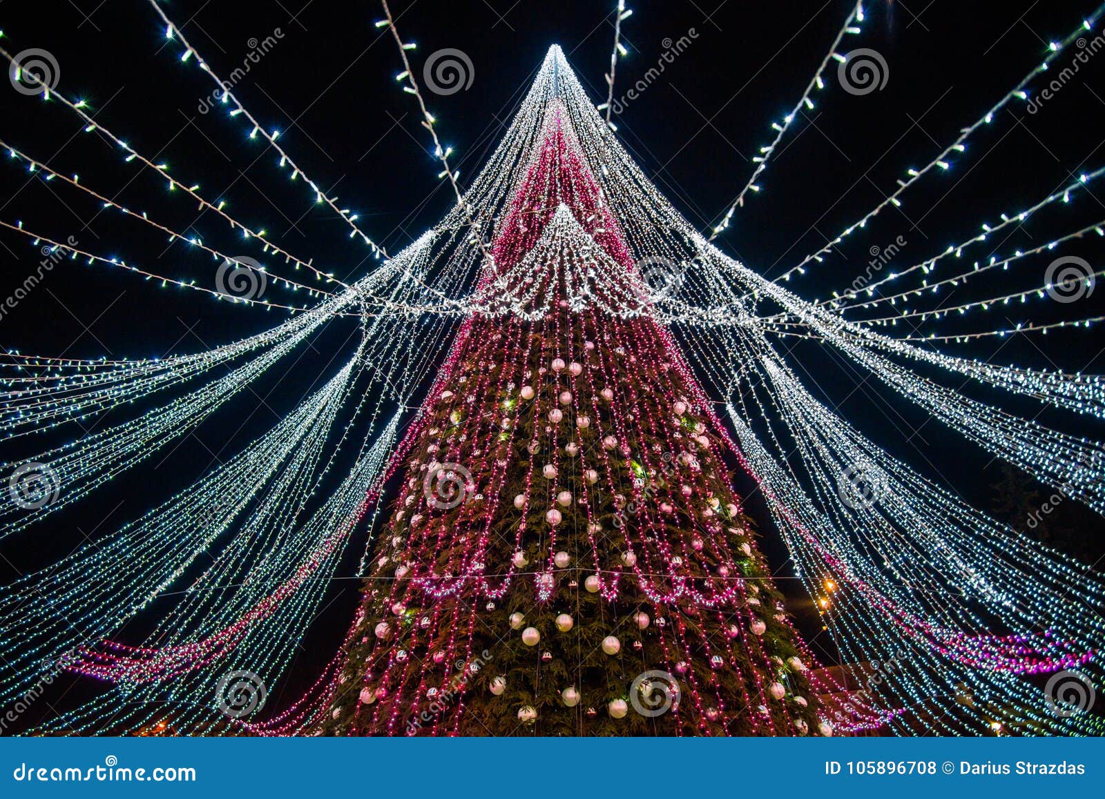 Xmas tree with many lights stock photo. Image of city - 105896708