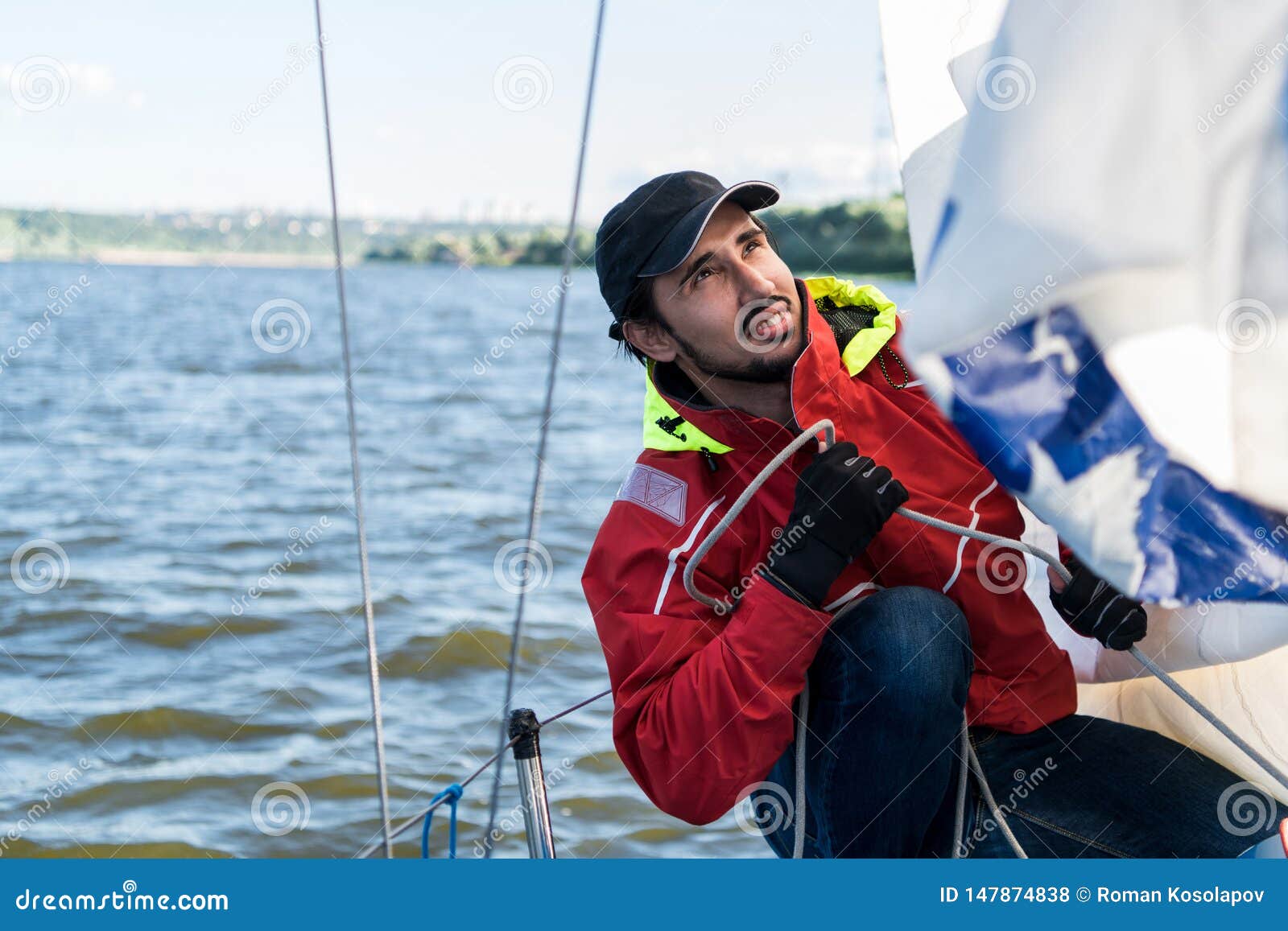Yacht Sailor Pulling Rope. Man Working on Sailboat. Stock Photo - Image ...