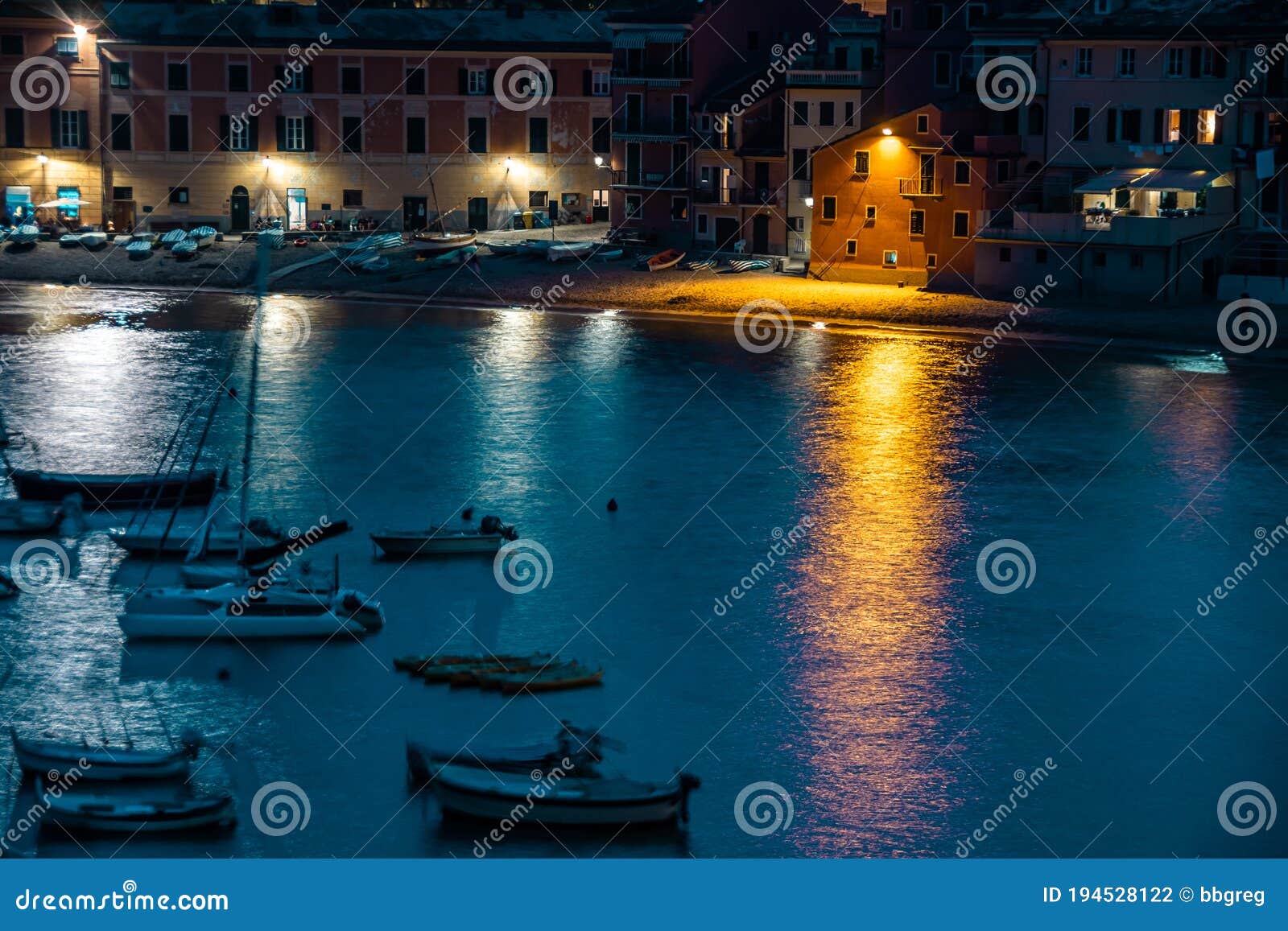 Yachts and Boats in the Bay. Reflection of Light from a Lantern on the ...