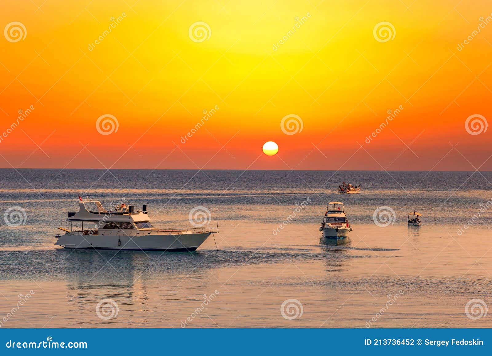 Yachts in a Sea Under Sunset Sky Stock Photo - Image of water, yachts ...