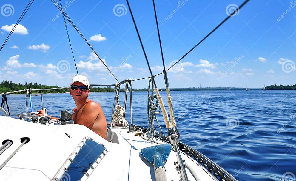A Yachtsman Ruddering a Boat Editorial Image - Image of hobby, spring ...