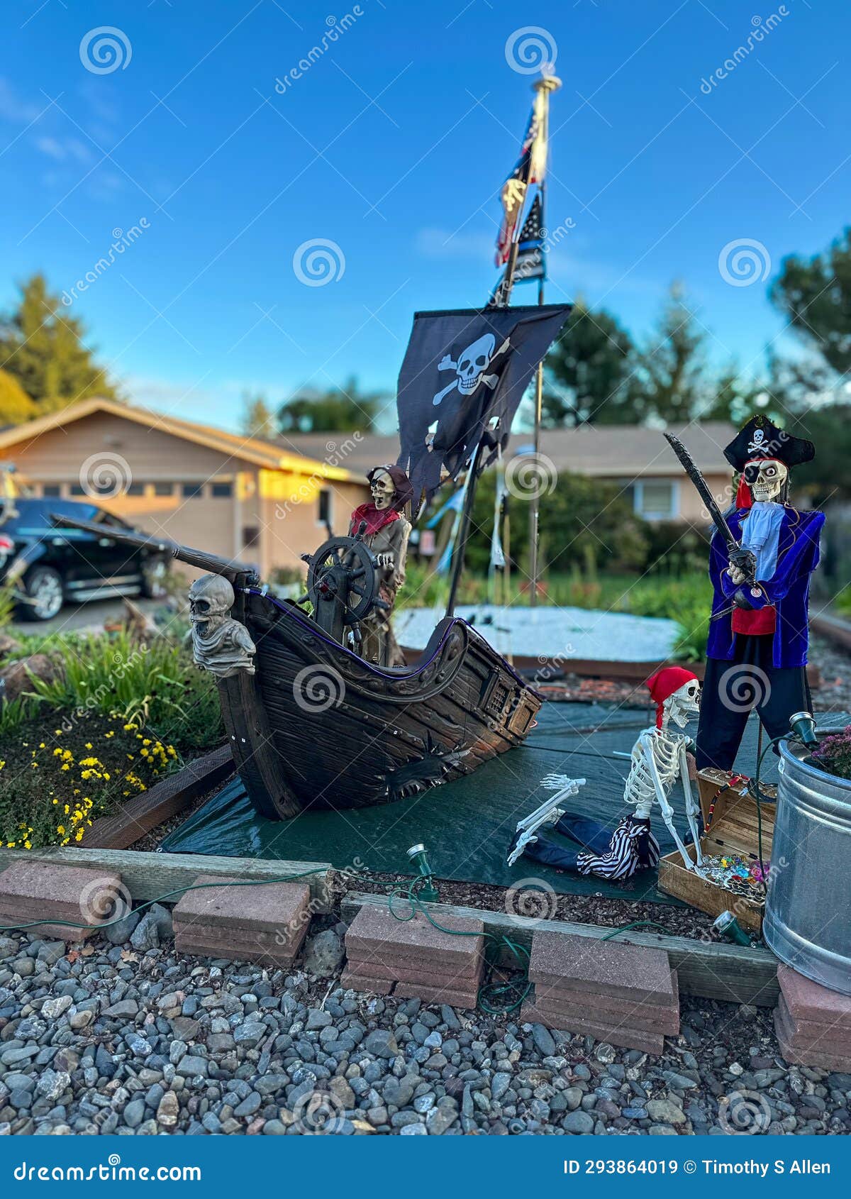 A Yard Has Halloween Decorations that Include a Pirate Ship, Pirate and ...