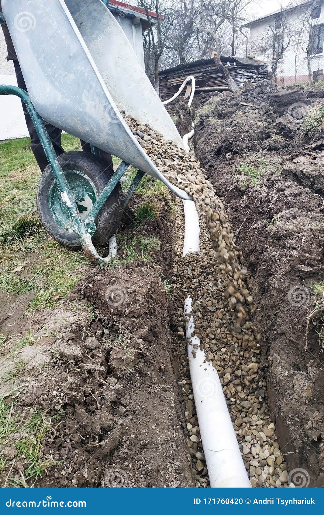 In the Yard, Workers Carry Out Drainage Works for Draining Water Stock ...
