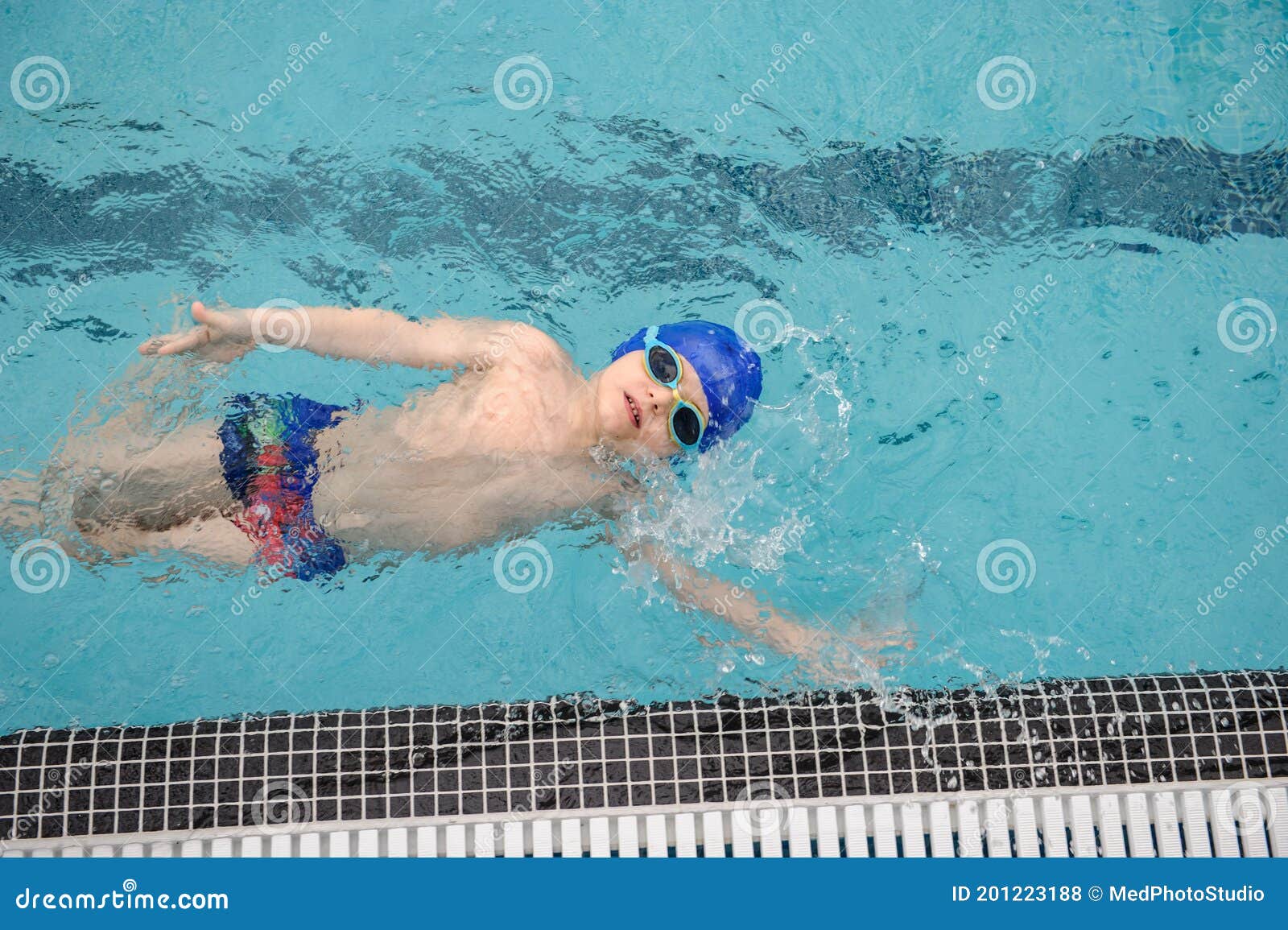 7-year Boy Swimming Backstroke in a Swimming Pool Stock Photo - Image ...