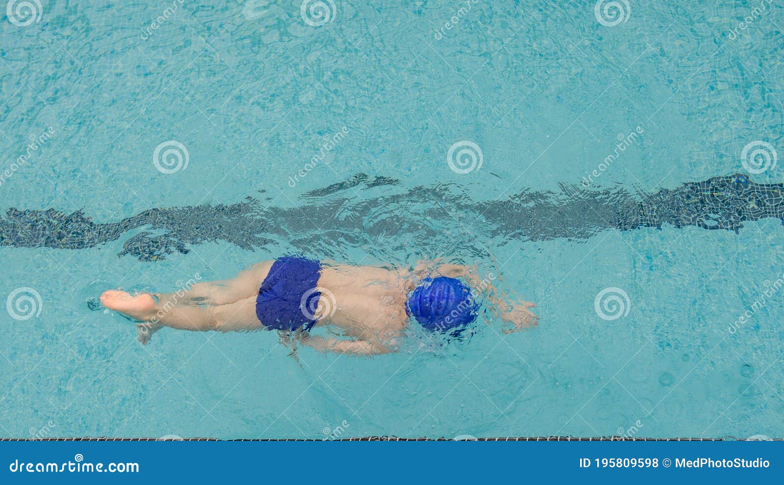 7-year Boy Swimming Backstroke in a Swimming Pool Stock Photo - Image ...