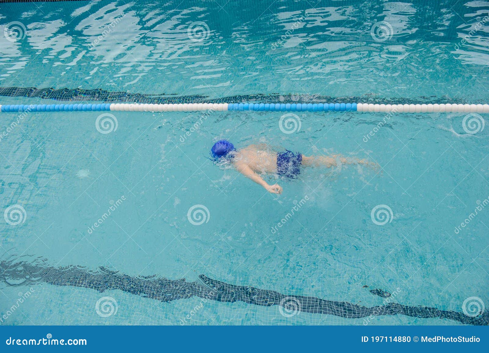 7-year Boy Swimming Backstroke in a Swimming Pool Stock Photo - Image ...