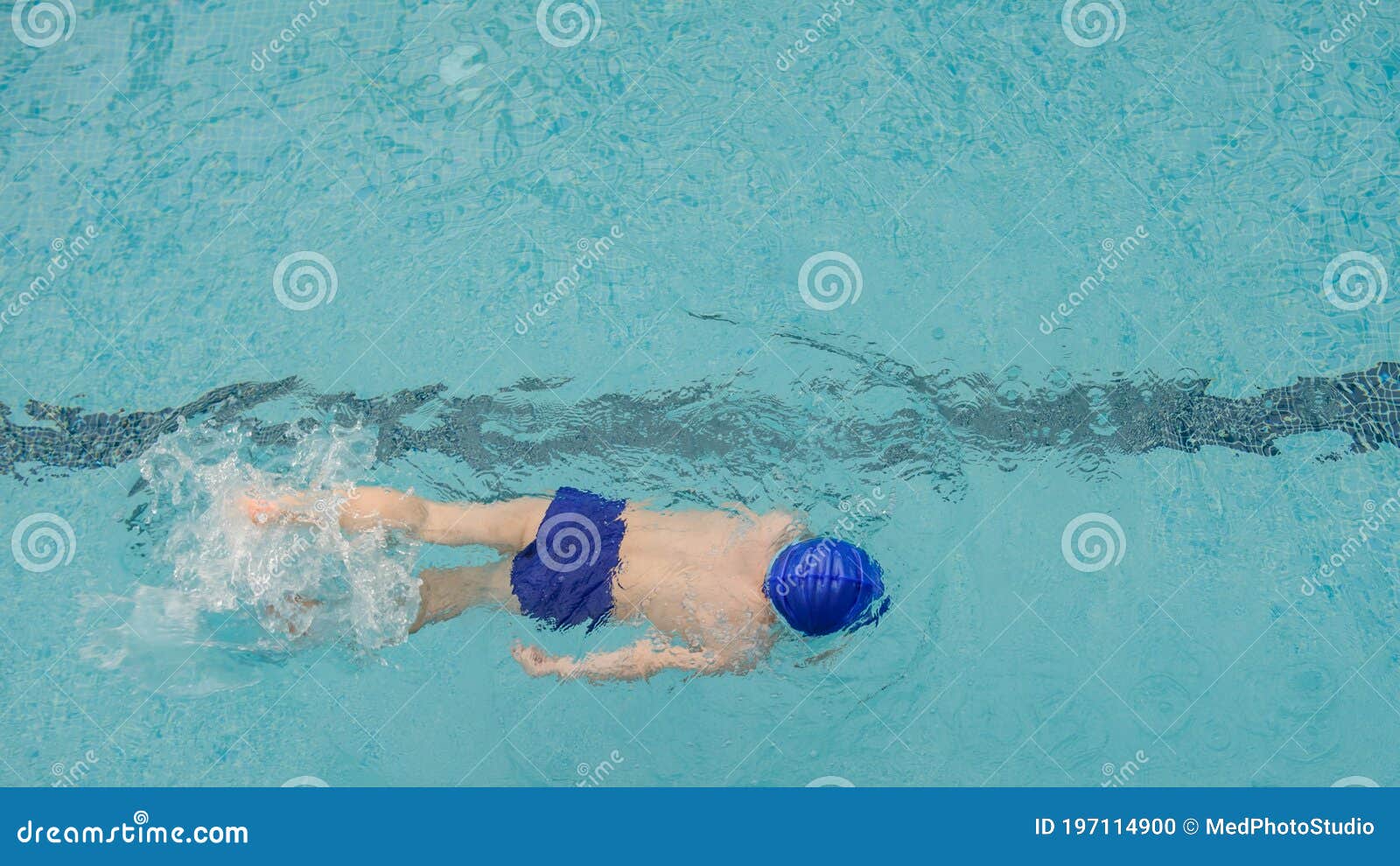 7-year Boy Swimming Backstroke in a Swimming Pool Stock Photo - Image ...