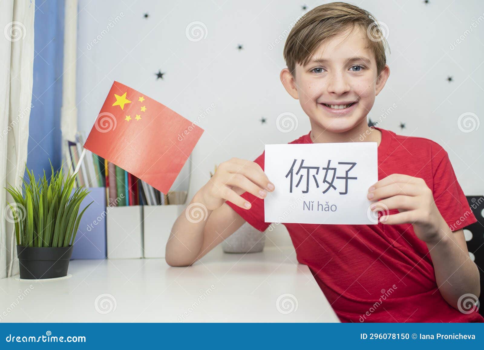 An 11 Year Old Boy is Learning a Foreign Language, Chinese. Stock Photo ...