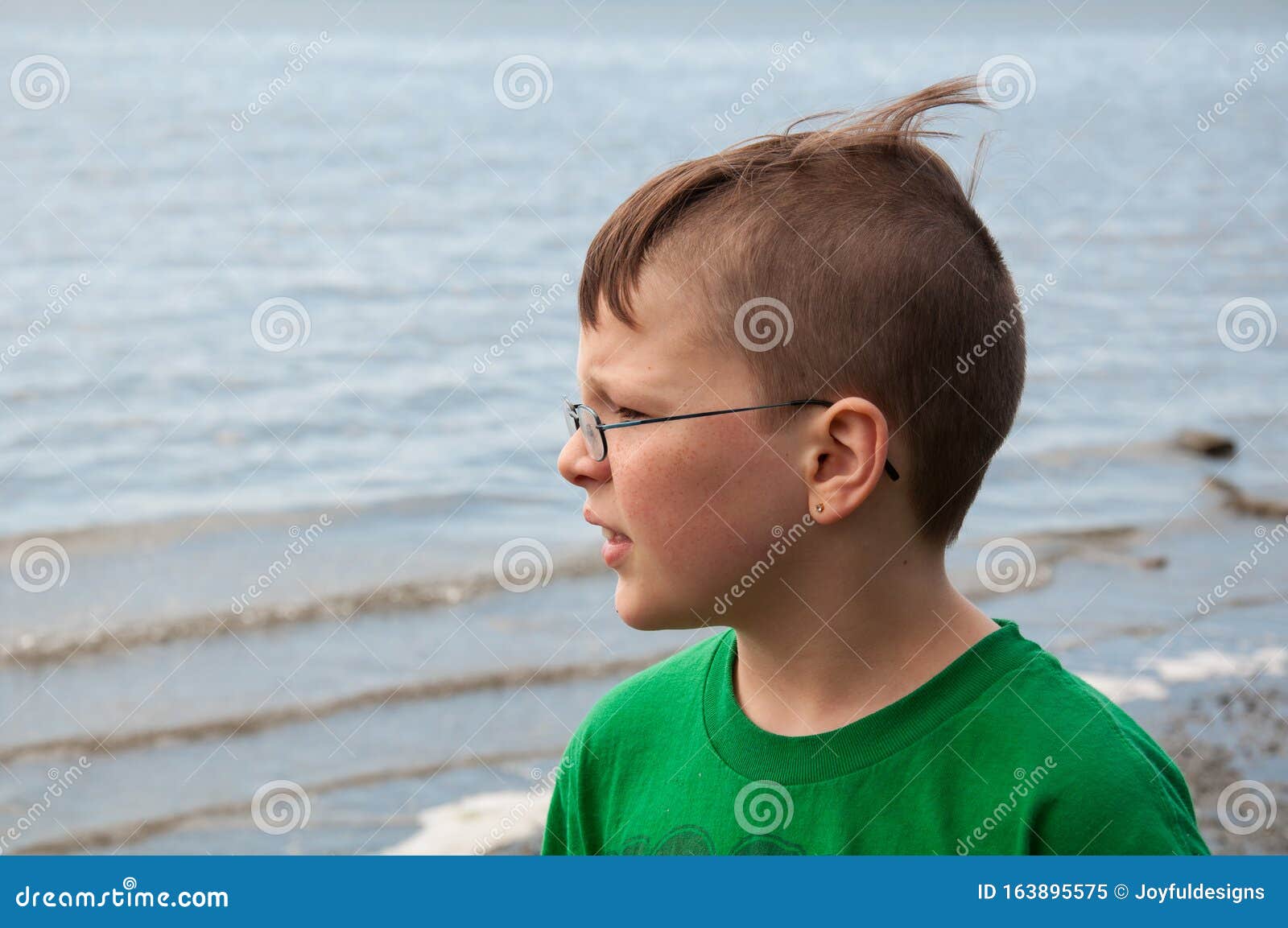 Cute Boy With Mohawk Haircut Winks With One Eye. A Freestanding Young ...