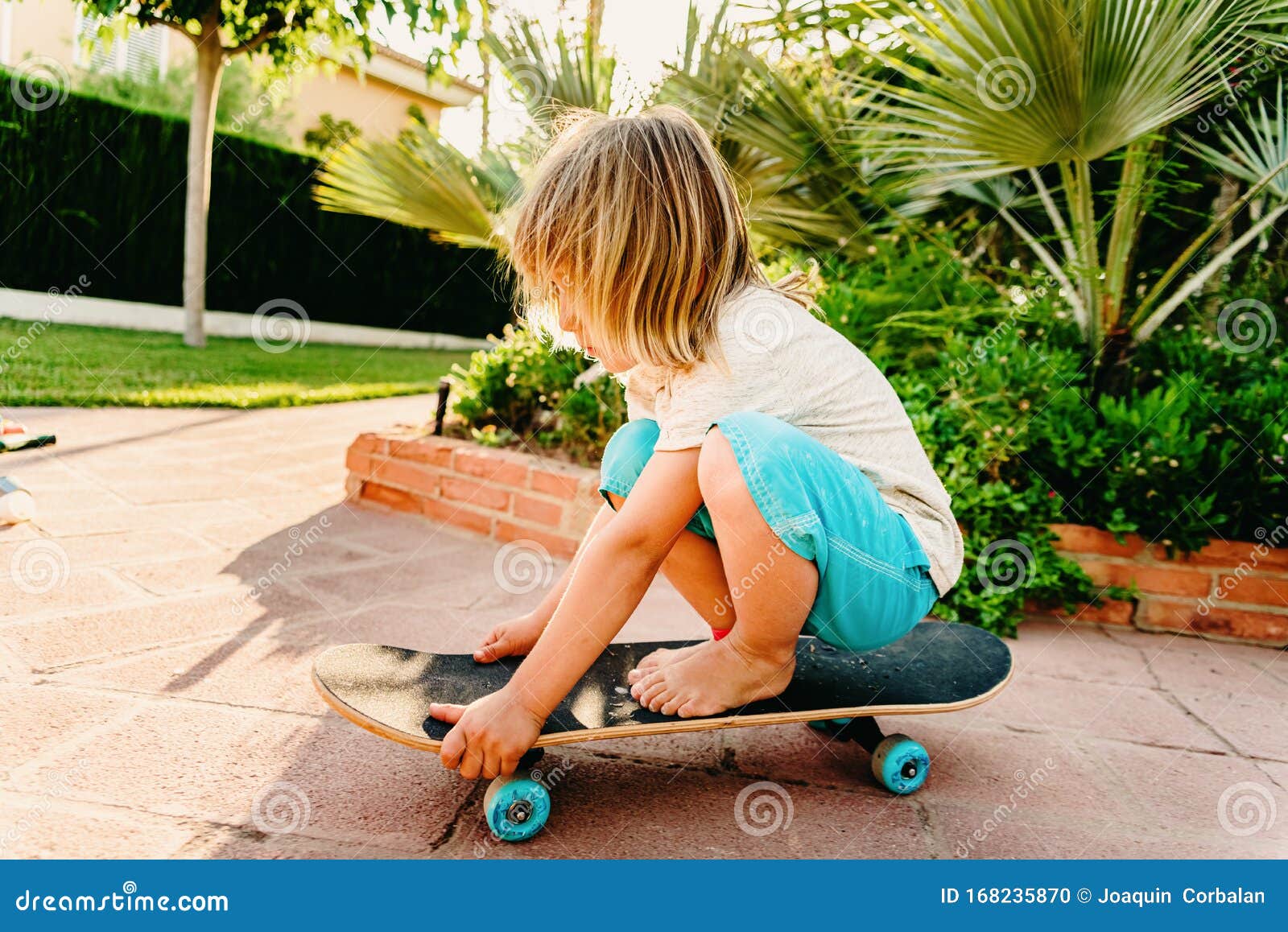 5 Year Old Boy Practicing Skate In His Backyard, Stumbling And Falling ...