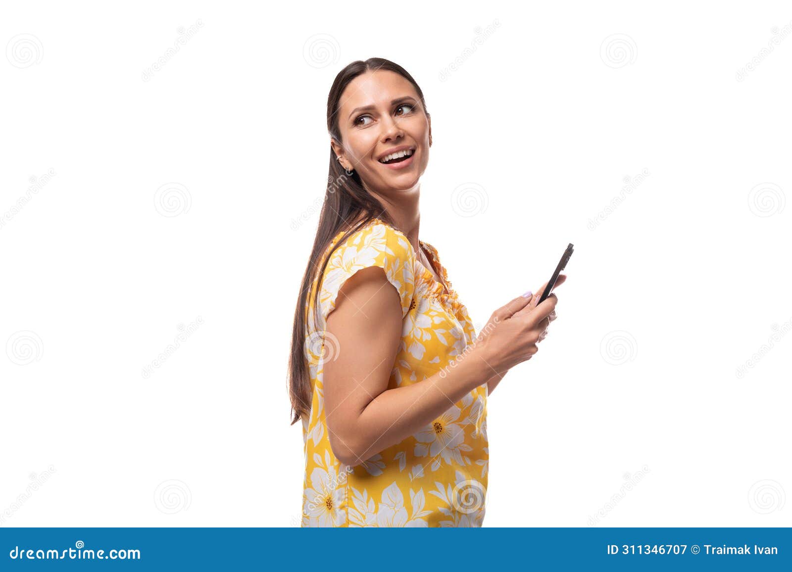 30 Year Old Brunette Woman Dressed In A Summer Outfit Chatting On A Smartphone Stock Image