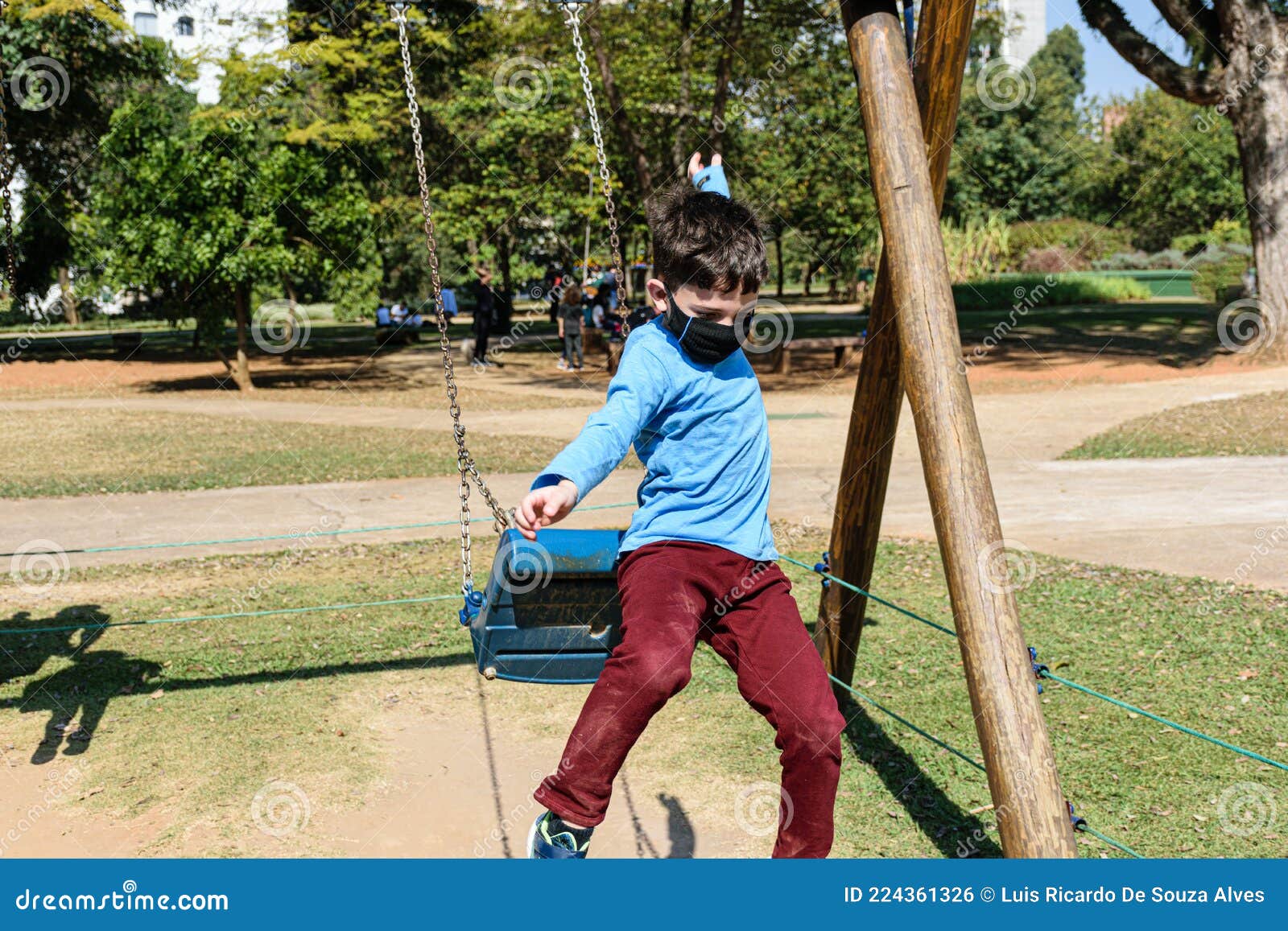 8 Year Old Child Jumping from a Swing on a Sunny Day Stock Photo ...